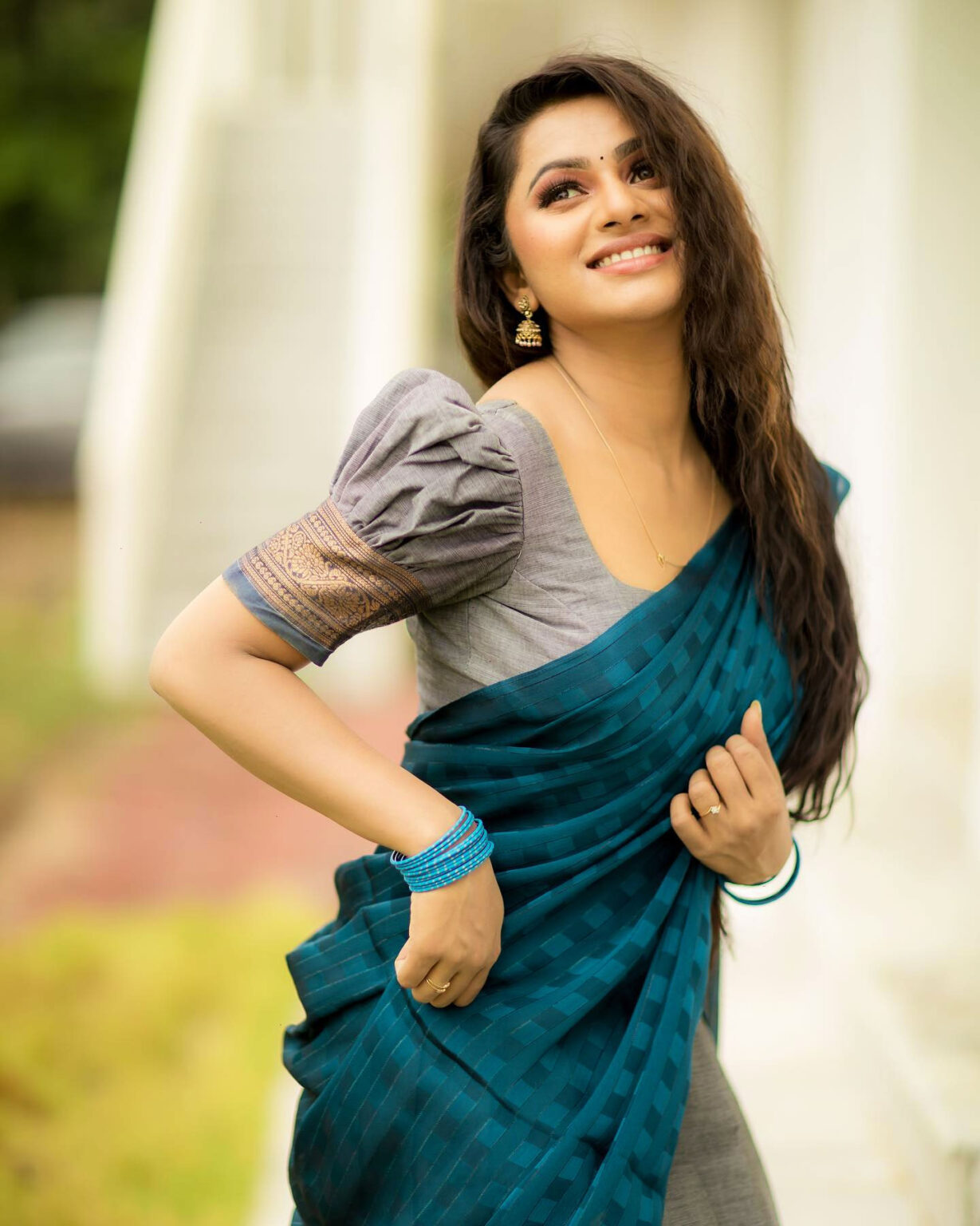 Delna Davis in peacock blue cotton half saree - South Indian Actress