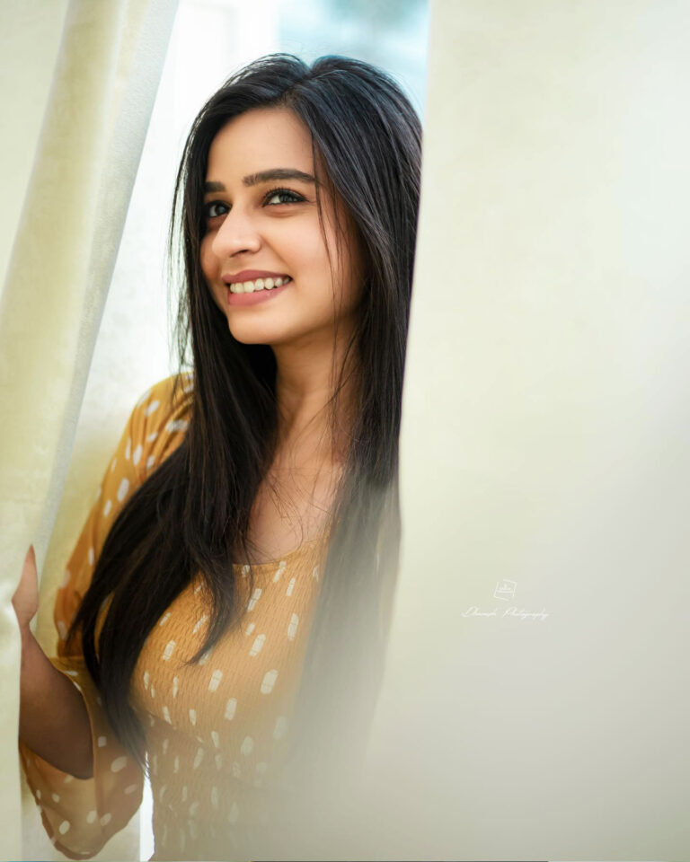 Divya Ganesh in smocked top photoshoot stills - South Indian Actress