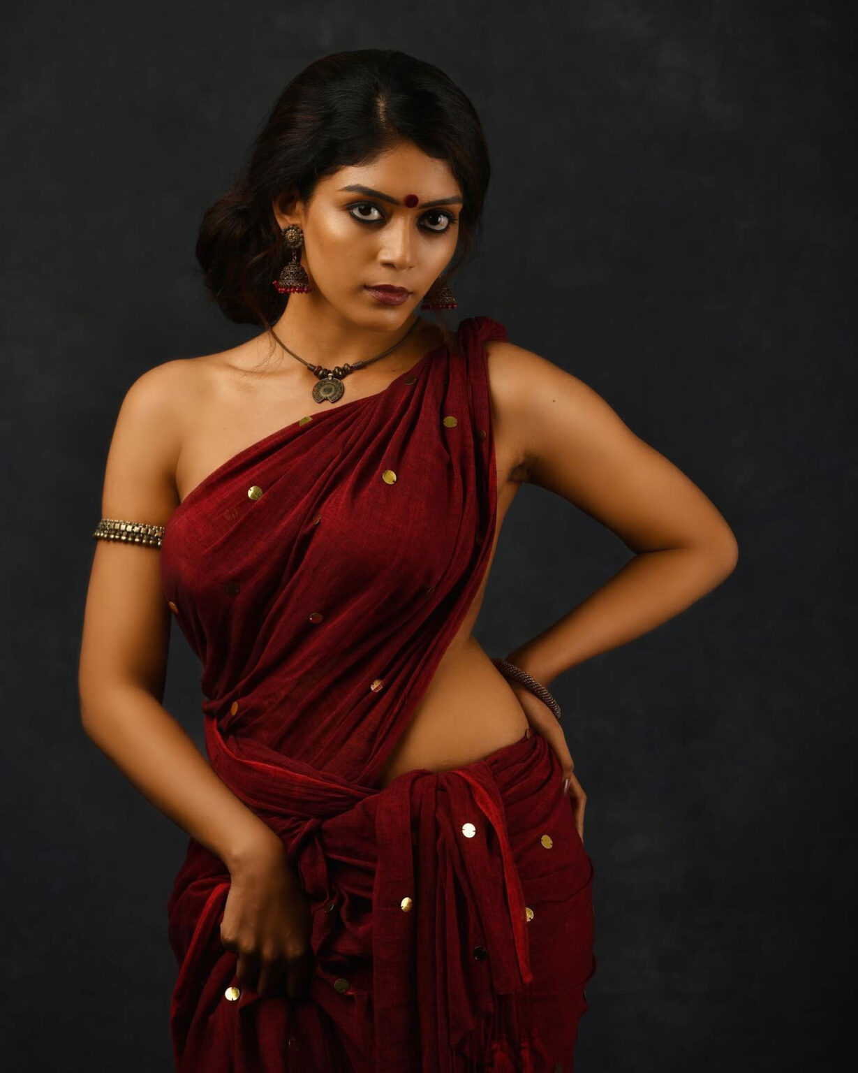 Raksha Cherin sizzling stills in blouse-less saree - South Indian Actress