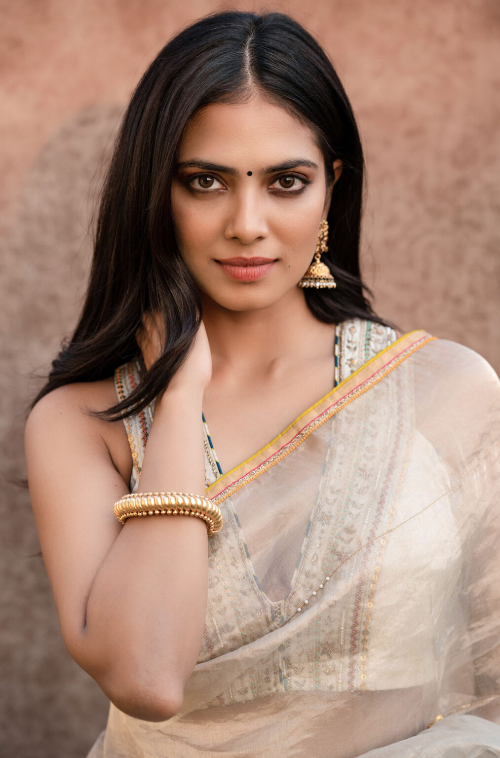 Malavika Mohanan in Ivory Golden tissue saree